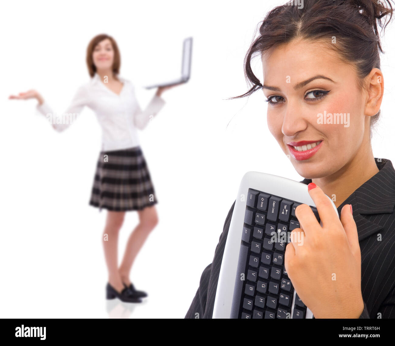 young businesswomen holding computer keyboard on white background Stock ...