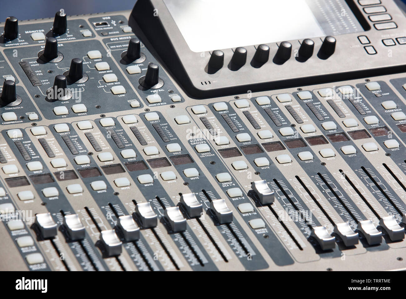 Sound mixer console detail with sliders and levels. Audio equipment ...