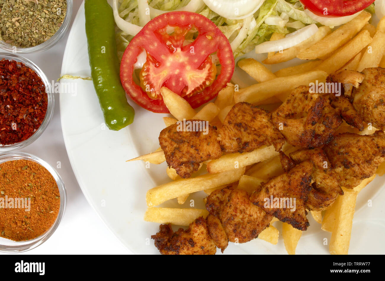 Chicken fillet ready to serve with french fries and salads Stock Photo ...