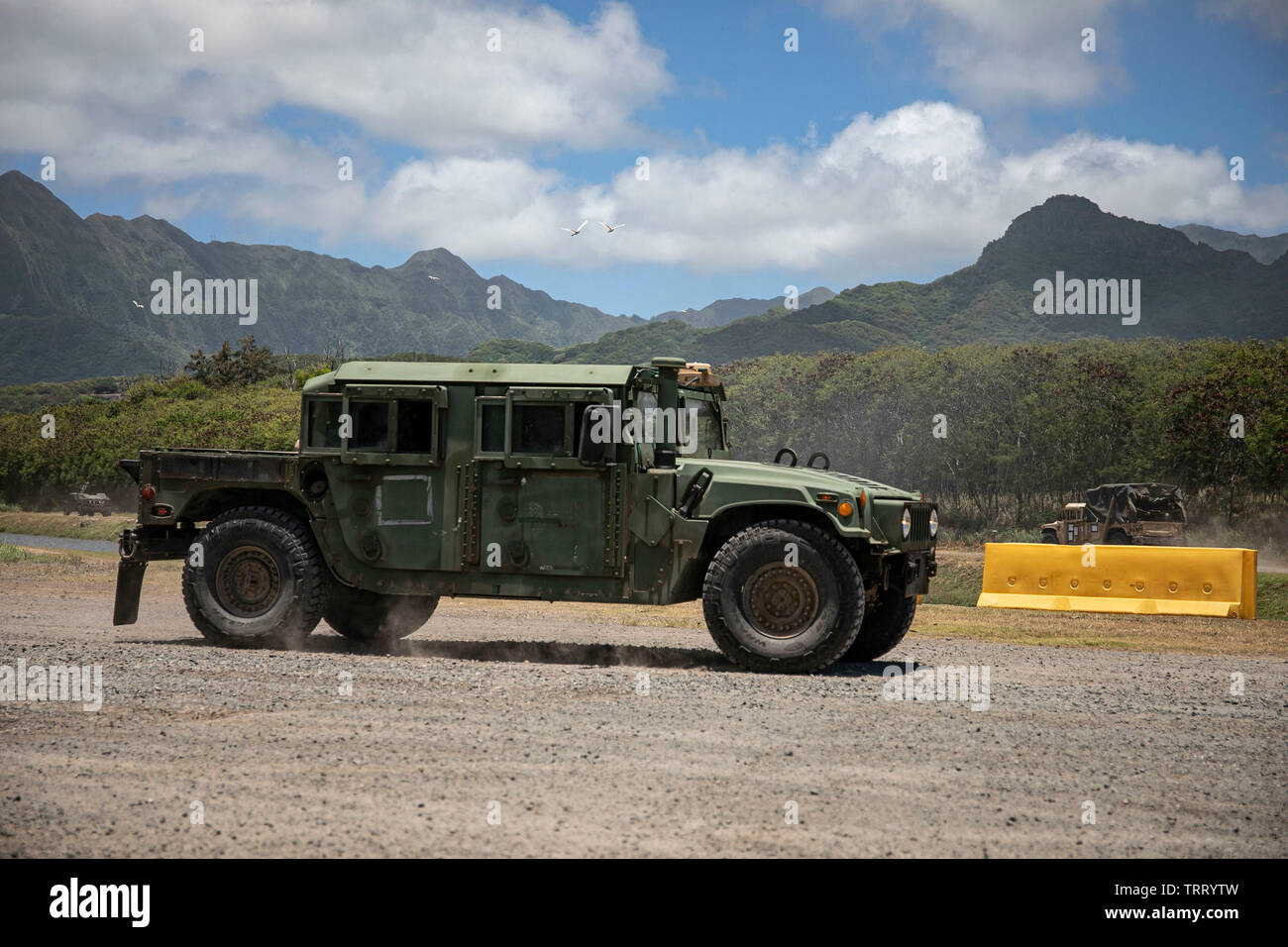 A U.S. Marine Corps High Mobility Multipurpose Wheeled Vehicle assigned ...