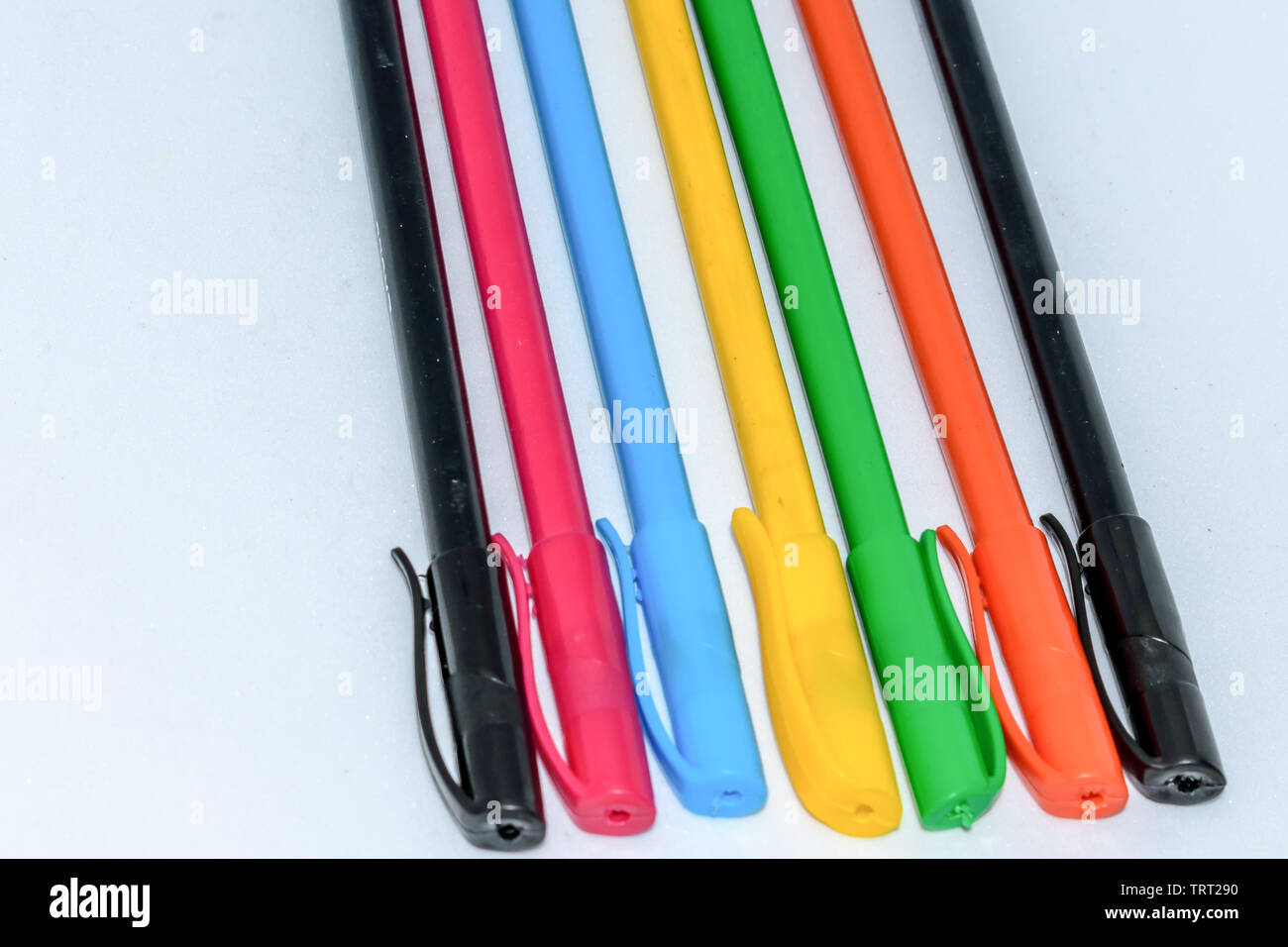 Close-up selection of Multi Colored Boll pint pens, close together in a ...