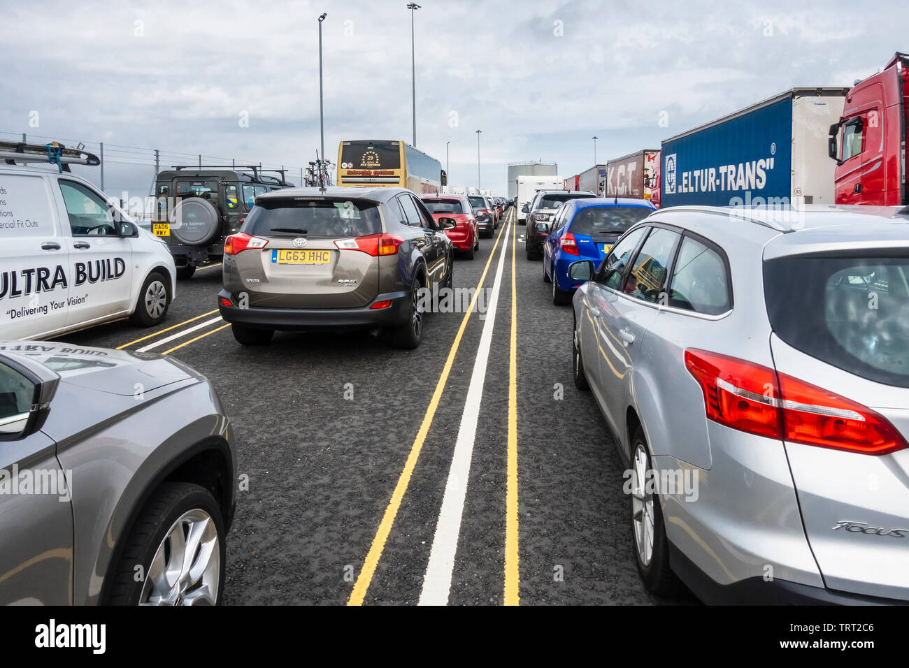 Vehicles queueing to board a car ferry to Dublin from Holyhead Port ...