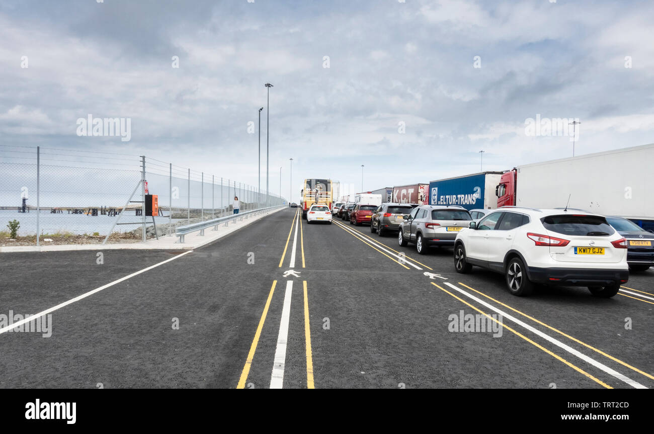 Vehicles queueing to board a car ferry to Dublin from Holyhead Port ...