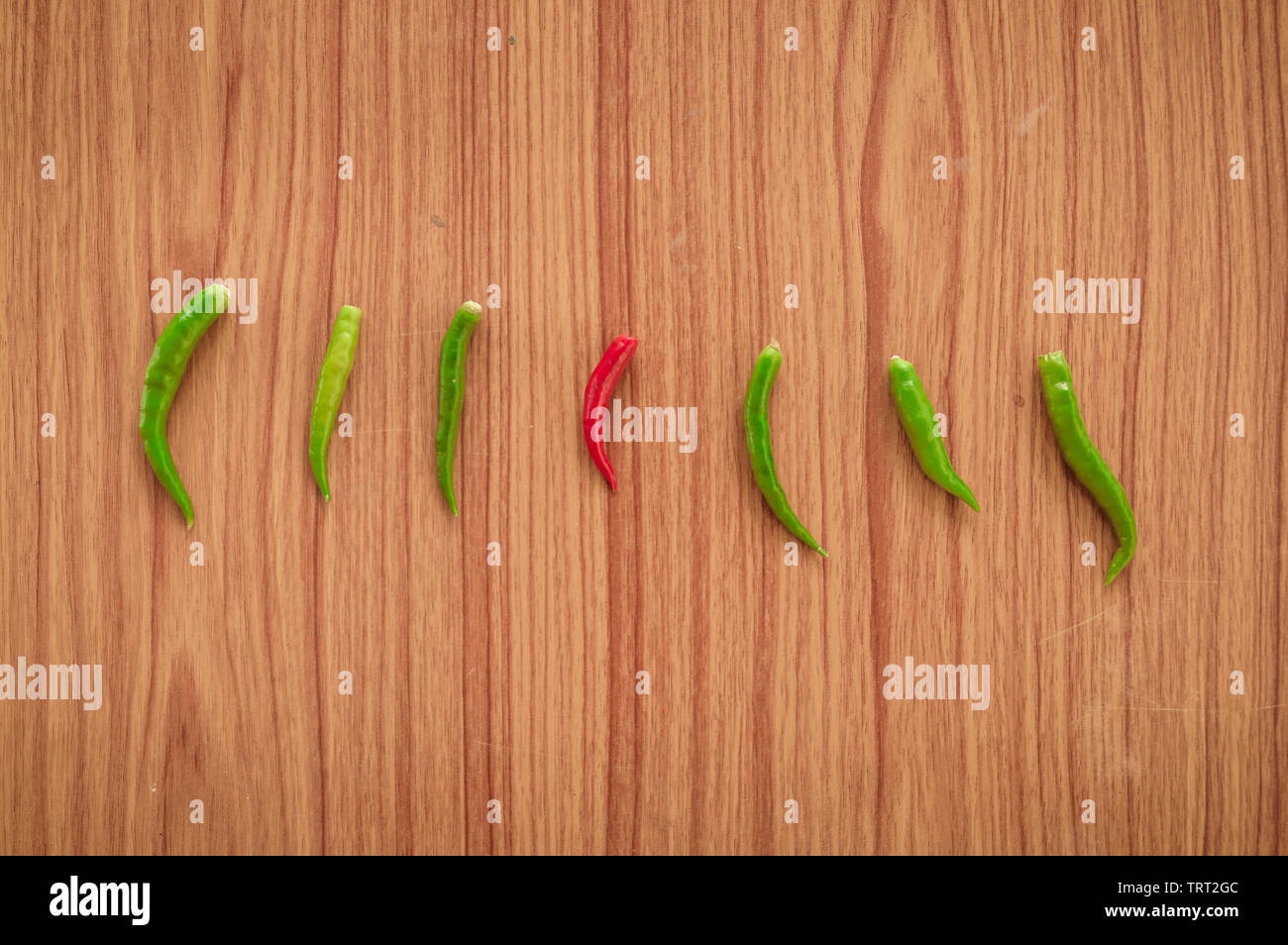 A Red hot spicy thai chili peppers or Mirchi among green chilli ...