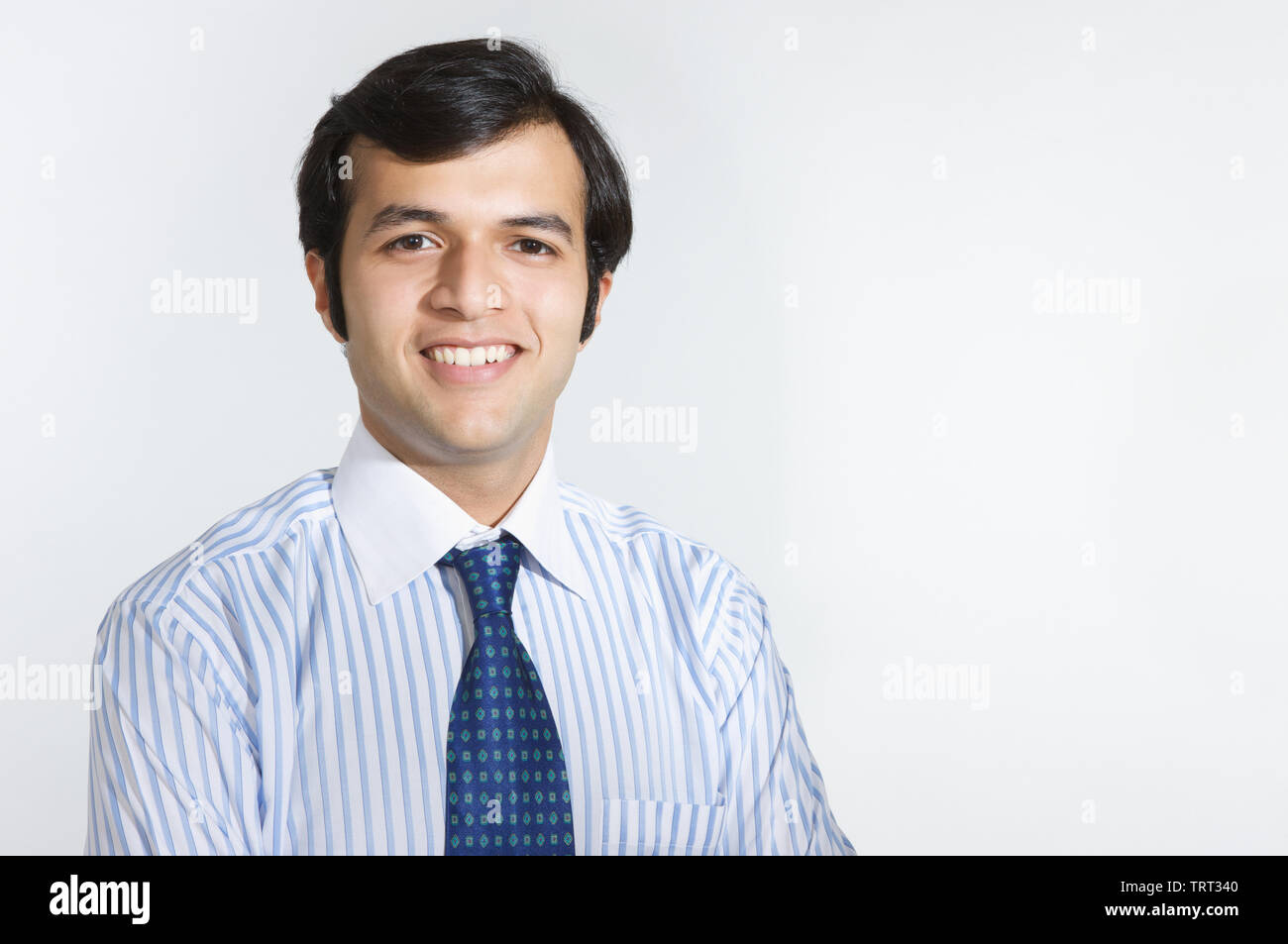 Portrait of a businessman smiling Stock Photo - Alamy