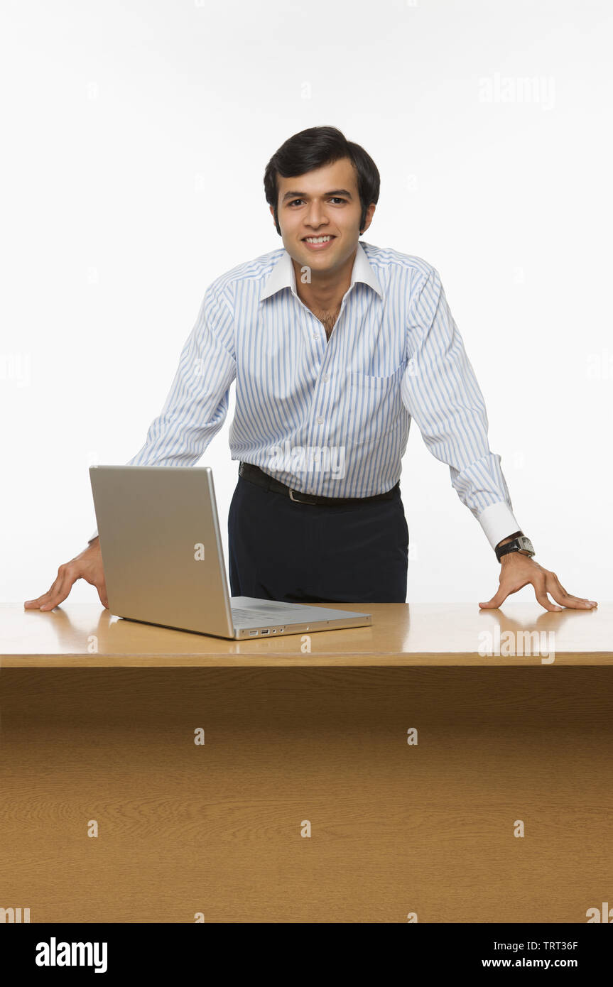 Young man leaning against table hi-res stock photography and images - Alamy