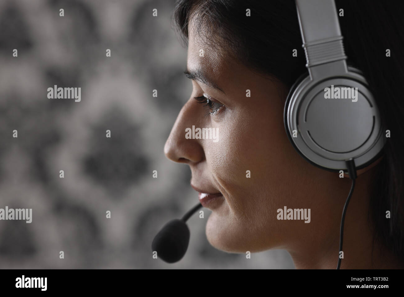 Indian woman wearing a headset Stock Photo - Alamy