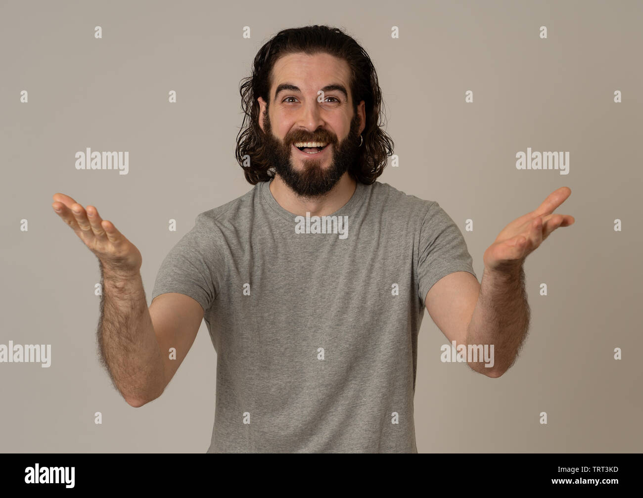 Portrait of funny attractive hipster man with happy and surprised face ...