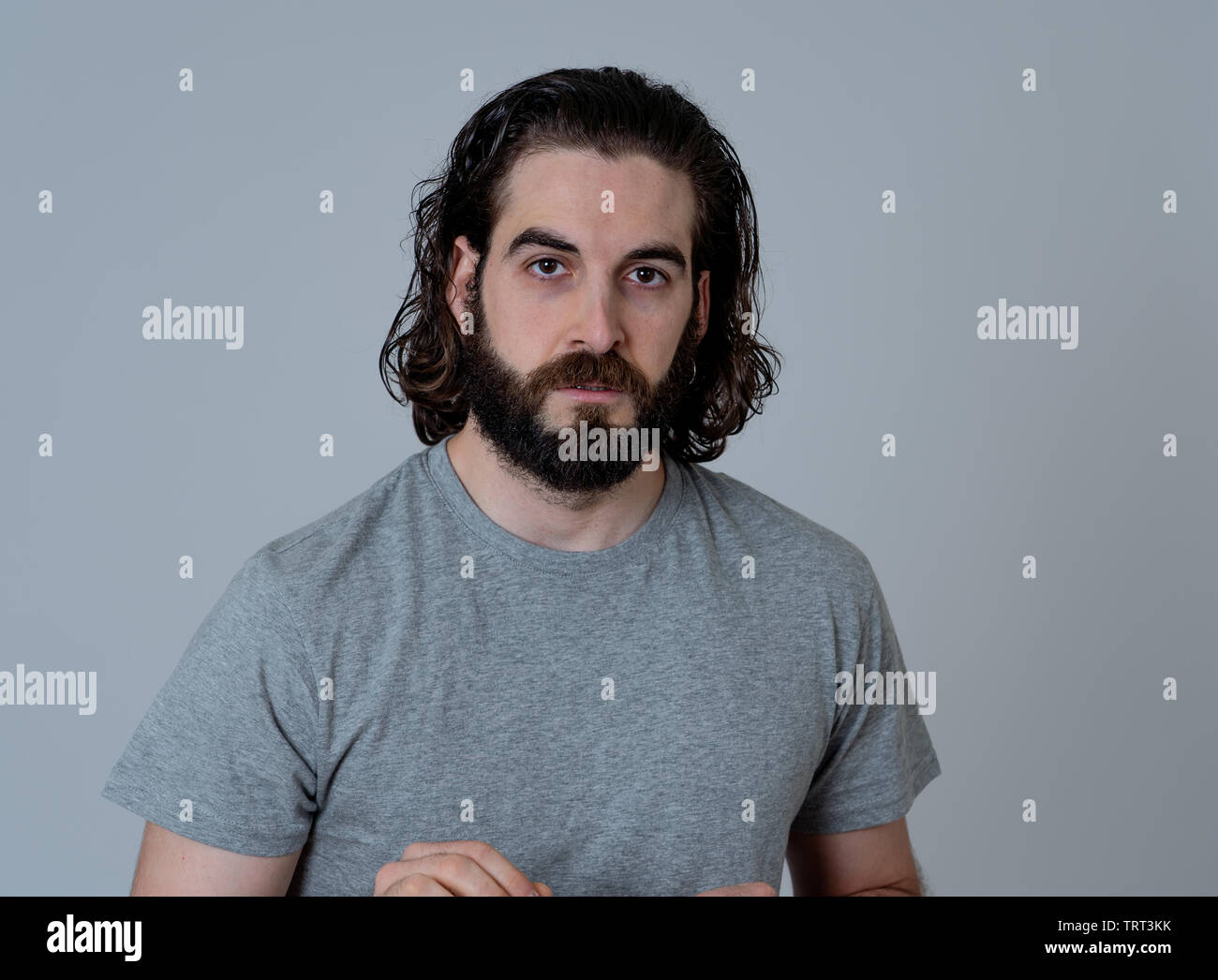 Portrait of funny attractive hipster man with happy and surprised face ...