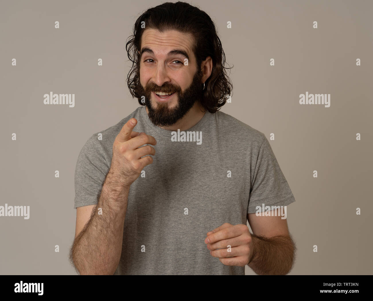 Portrait of funny attractive hipster man with happy and surprised face ...