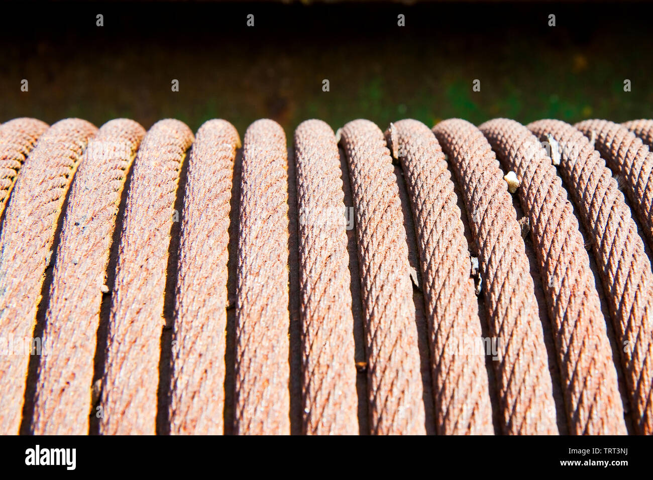 Detail of an old steel cable wrapped up in a coil Stock Photo - Alamy