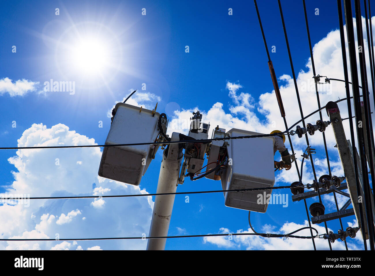 Aerial power lines with people working hi-res stock photography and ...