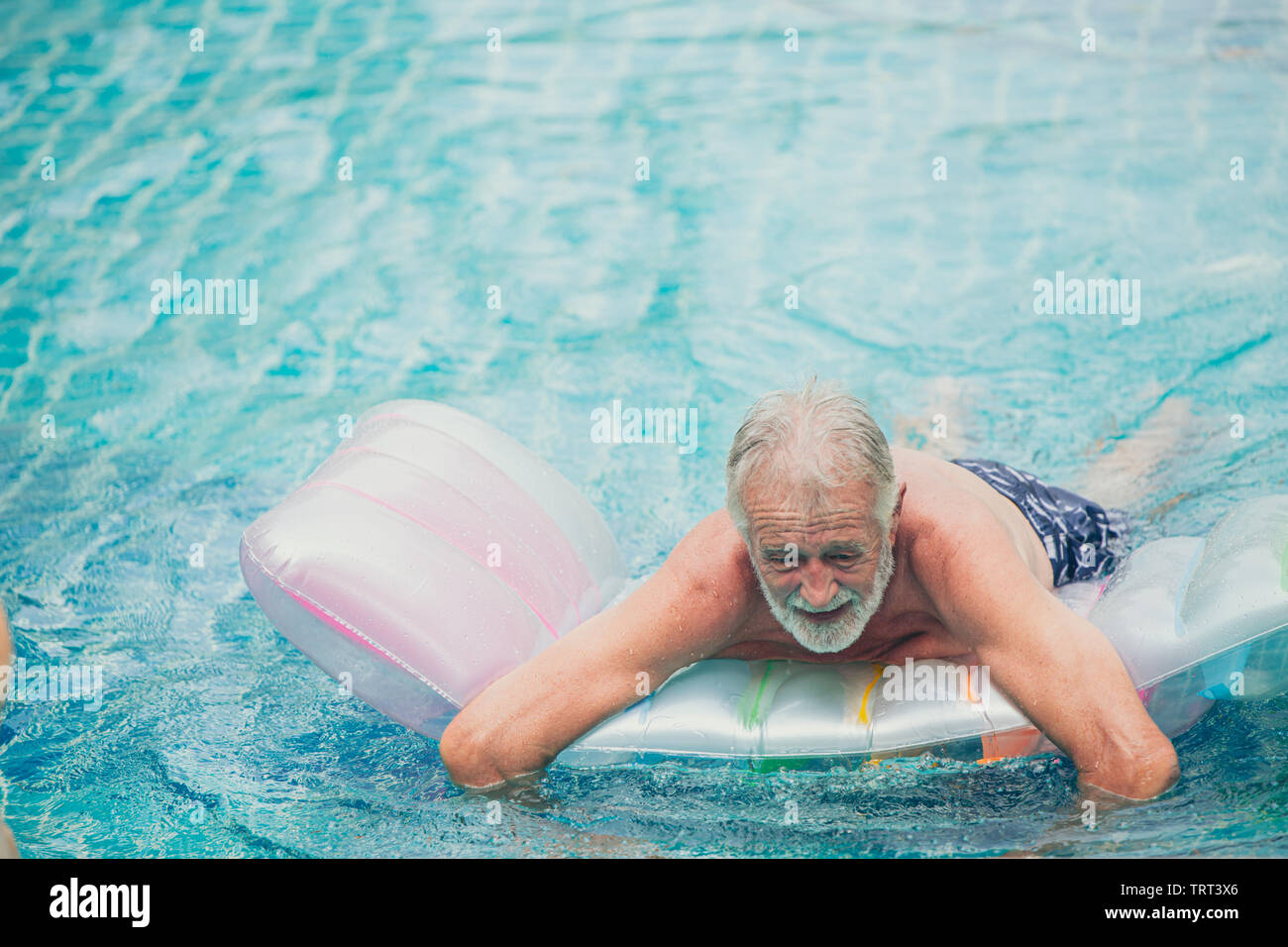 Lonely elder, Old man playing at pool alone at nursing home with sad ...