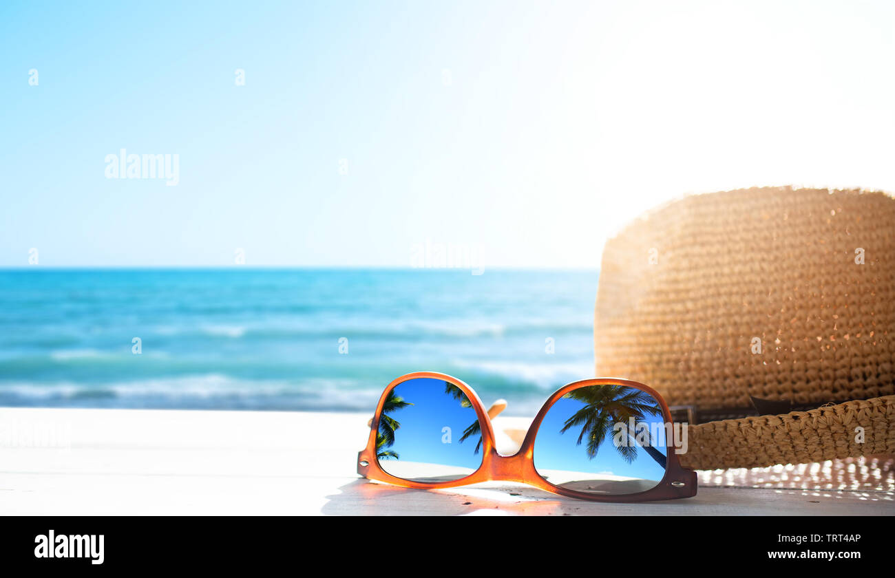 summer tropical beach background; glasses and palm tree reflex Stock ...