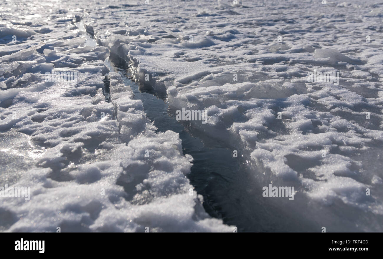 Big crack on the frozen sea Stock Photo - Alamy