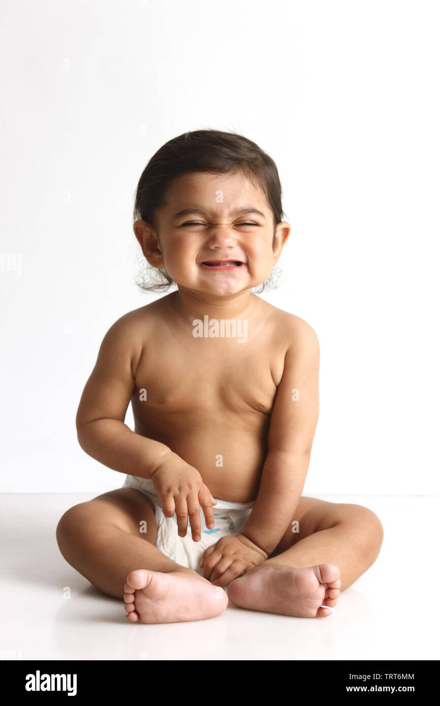 Baby boy making a face Stock Photo - Alamy
