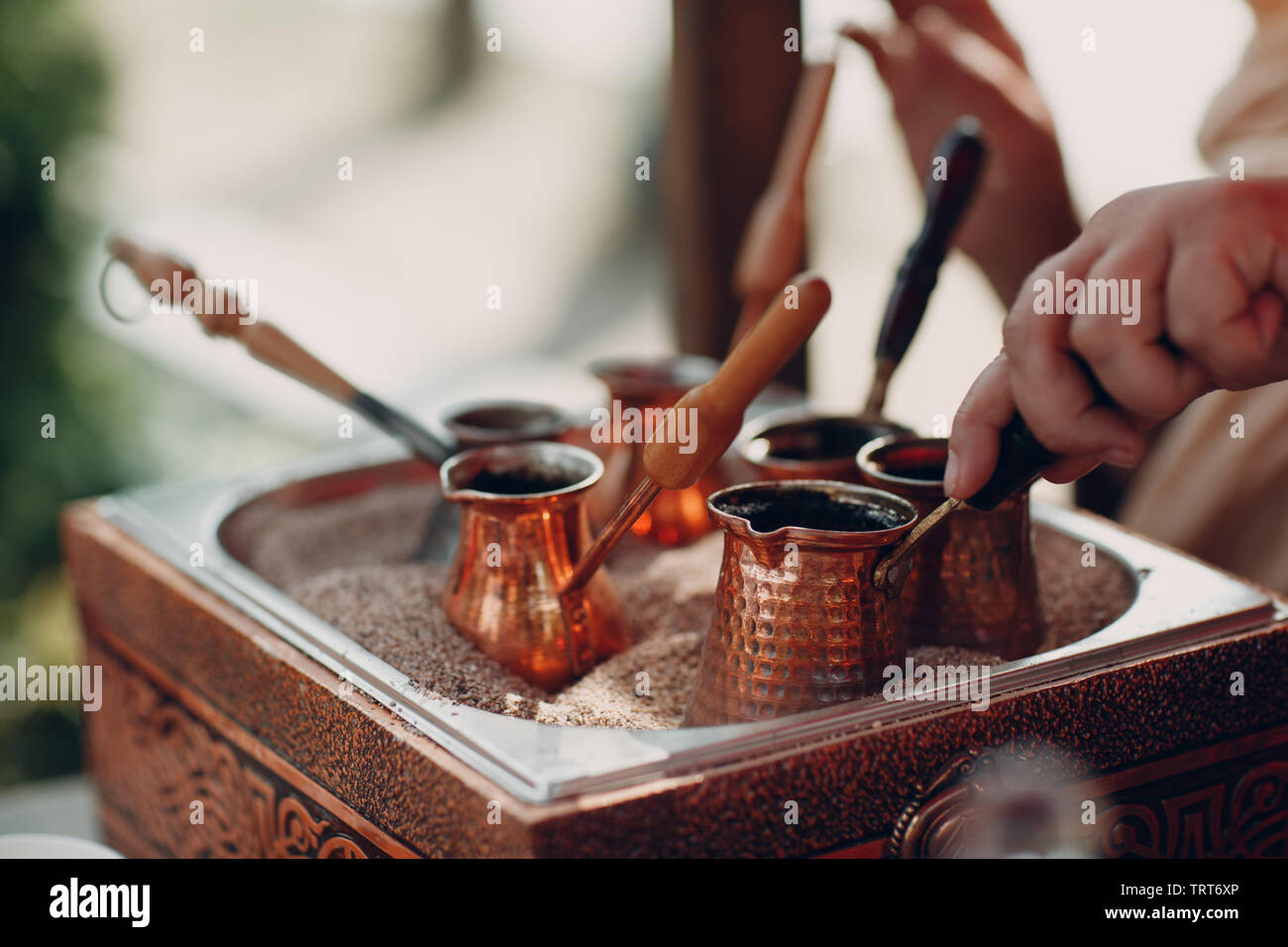 Making Turkish Arabic Coffee in the Sand in jezve Stock Photo - Alamy