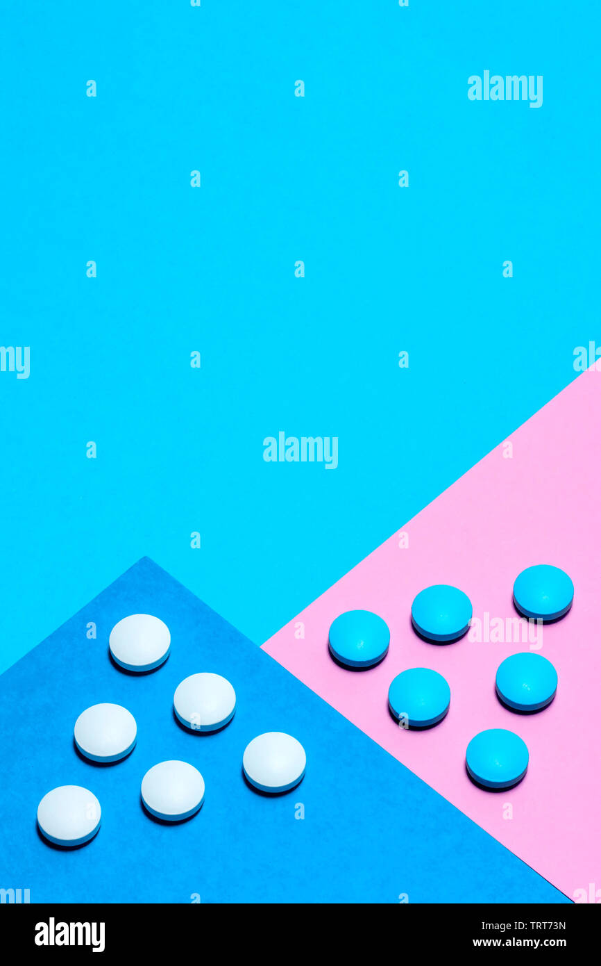 blue and white tablets laid out in the form of a triangle or an arrow ...