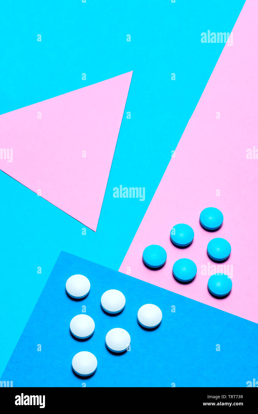 Pink pills in form triangle hi-res stock photography and images - Alamy