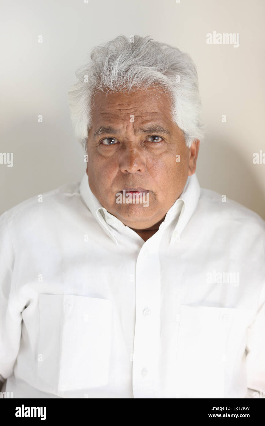 Indian grumpy man serious sulking hi-res stock photography and images ...