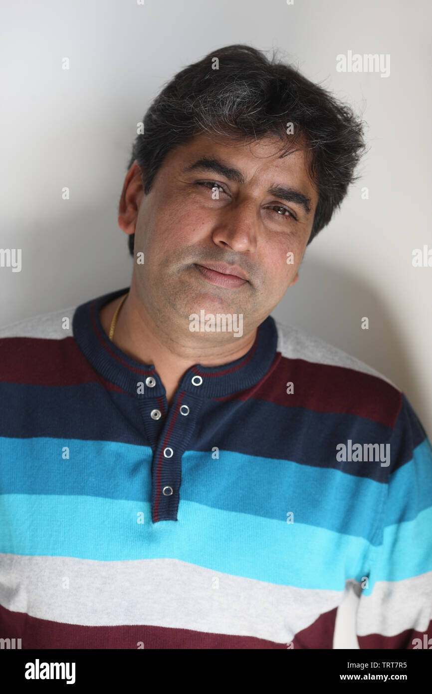 Indian grumpy man serious sulking hi-res stock photography and images ...