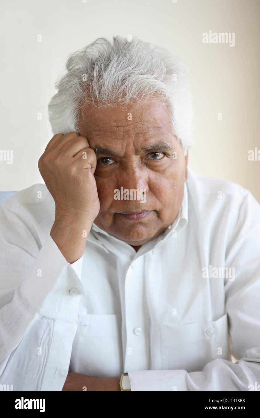 Indian grumpy man serious sulking hi-res stock photography and images ...