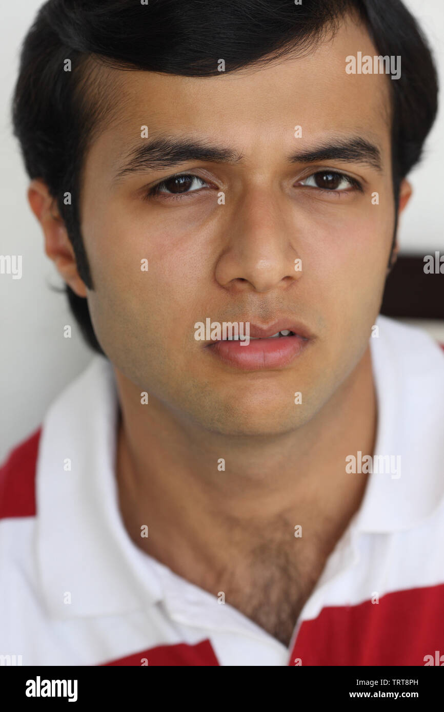 Indian grumpy man serious sulking hi-res stock photography and images ...