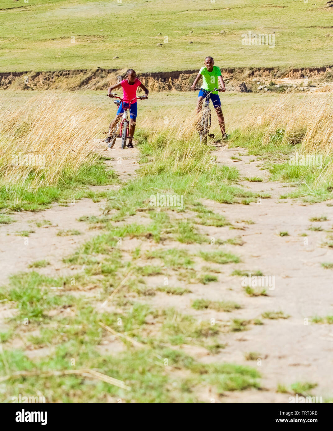 Harrismith, South Africa - October 18 2012: African Children riding a ...