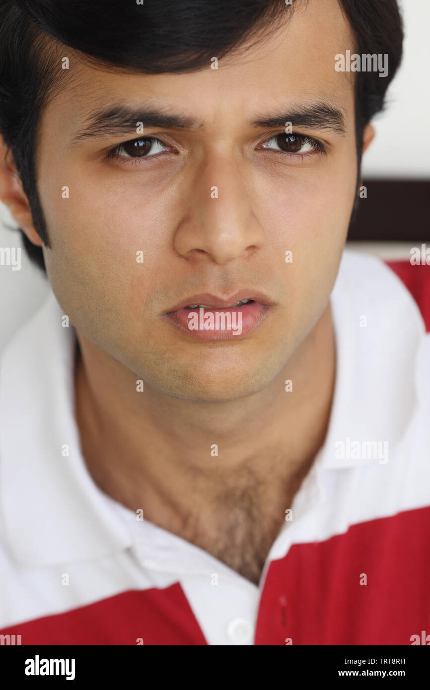 Indian grumpy man serious sulking hi-res stock photography and images ...