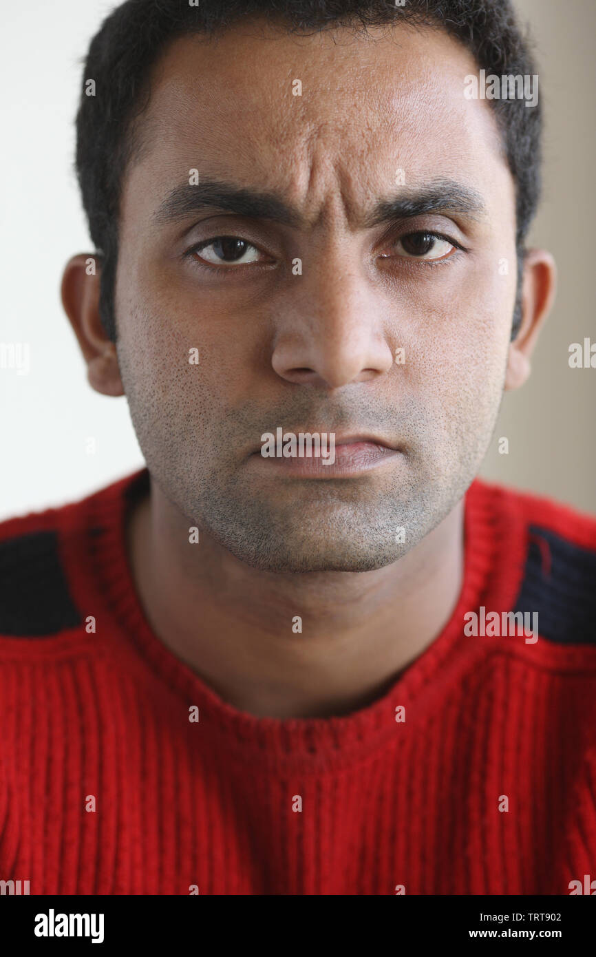 Indian grumpy man serious sulking hi-res stock photography and images ...