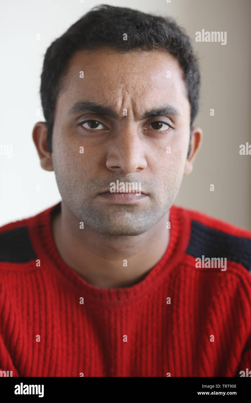 Indian grumpy man serious sulking hi-res stock photography and images ...