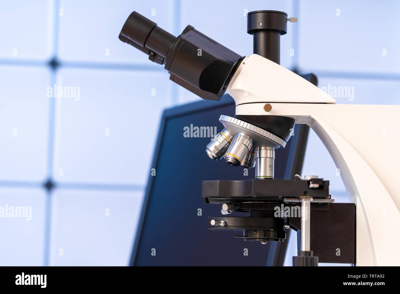 Scientific experiment in microbiological lab. Microscope and test tube ...