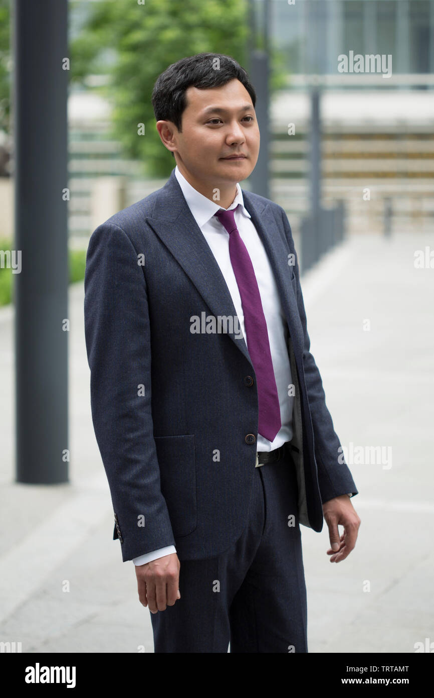 Asian businessman in black suit Stock Photo - Alamy