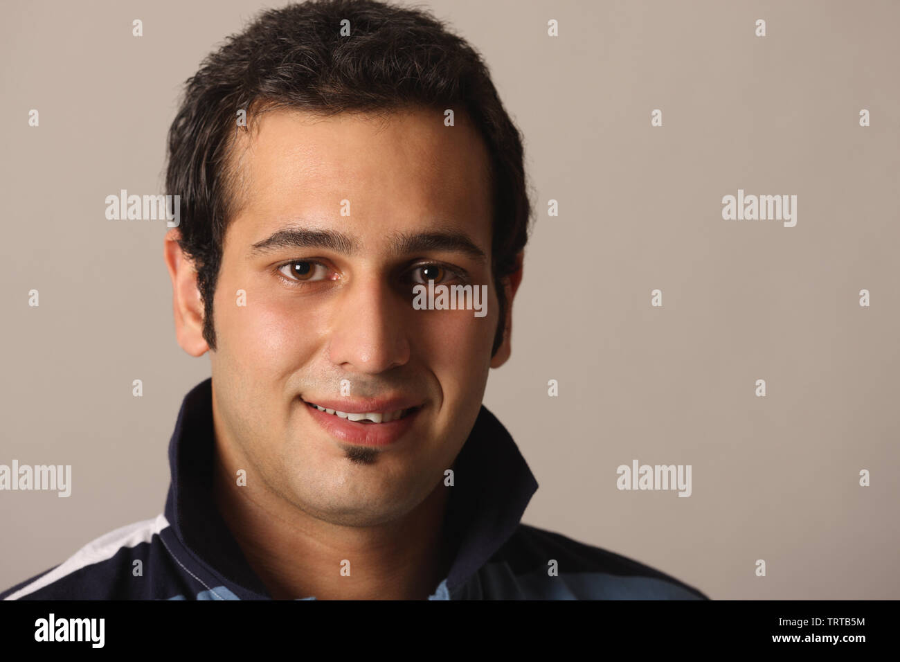 Portrait of an Indian man smiling Stock Photo - Alamy