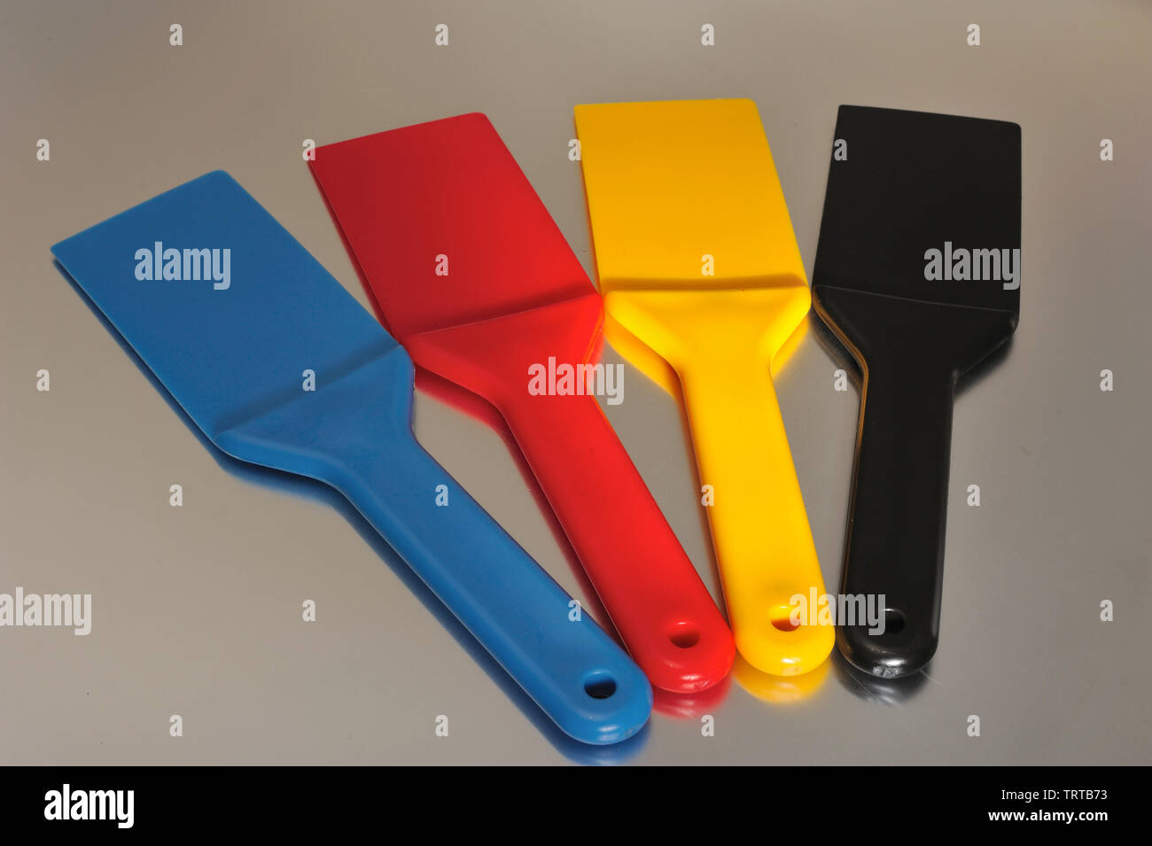 Spatulas to spread the ink used in offset printing Stock Photo - Alamy