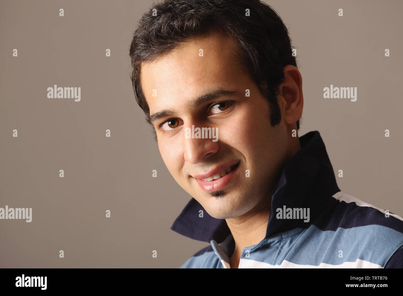 Portrait of an Indian man smiling Stock Photo - Alamy