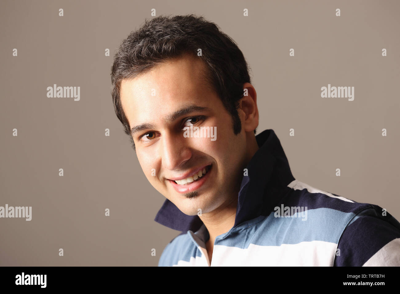 Portrait of an Indian man smiling Stock Photo - Alamy
