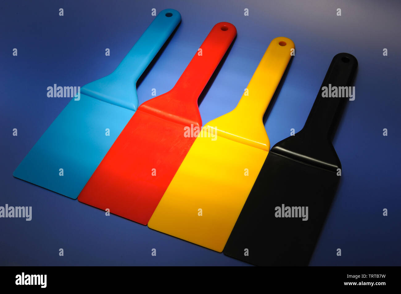 Spatulas to spread the ink used in offset printing Stock Photo - Alamy