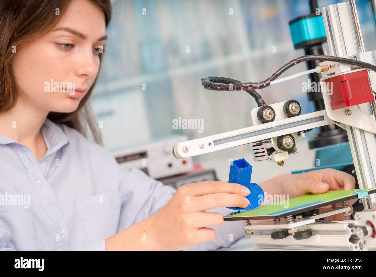 A student girl print prototype on 3D printer Stock Photo - Alamy