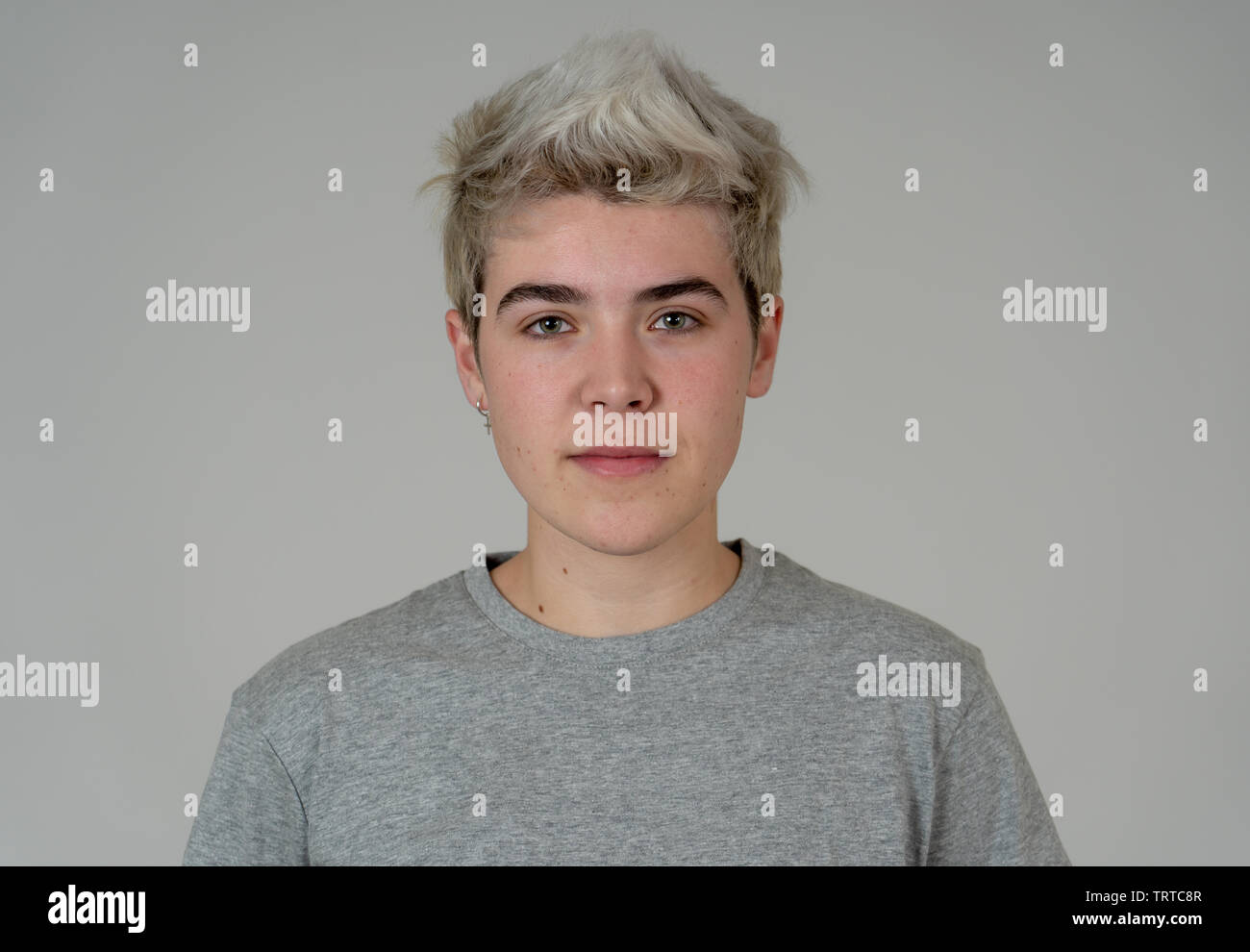 Close up portrait of young transgender teenager male with natural and ...