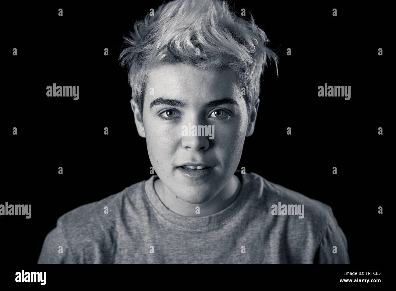 Portrait of handsome young transgender teenager man with beautiful ...