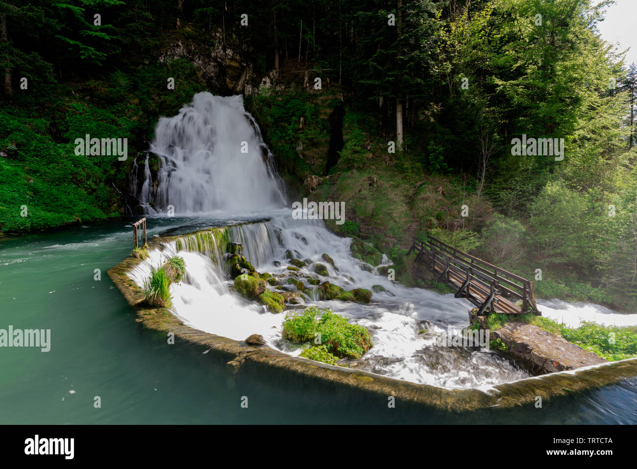 the idyllic and picturesque Jaunfall waterfall in the Swiss Alps in the ...