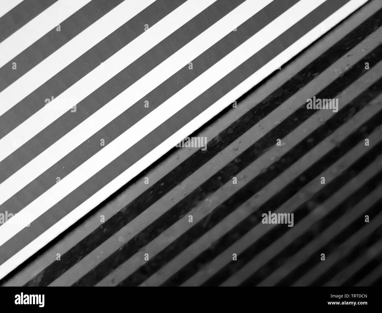 Reflection of lined box on black granite Stock Photo - Alamy