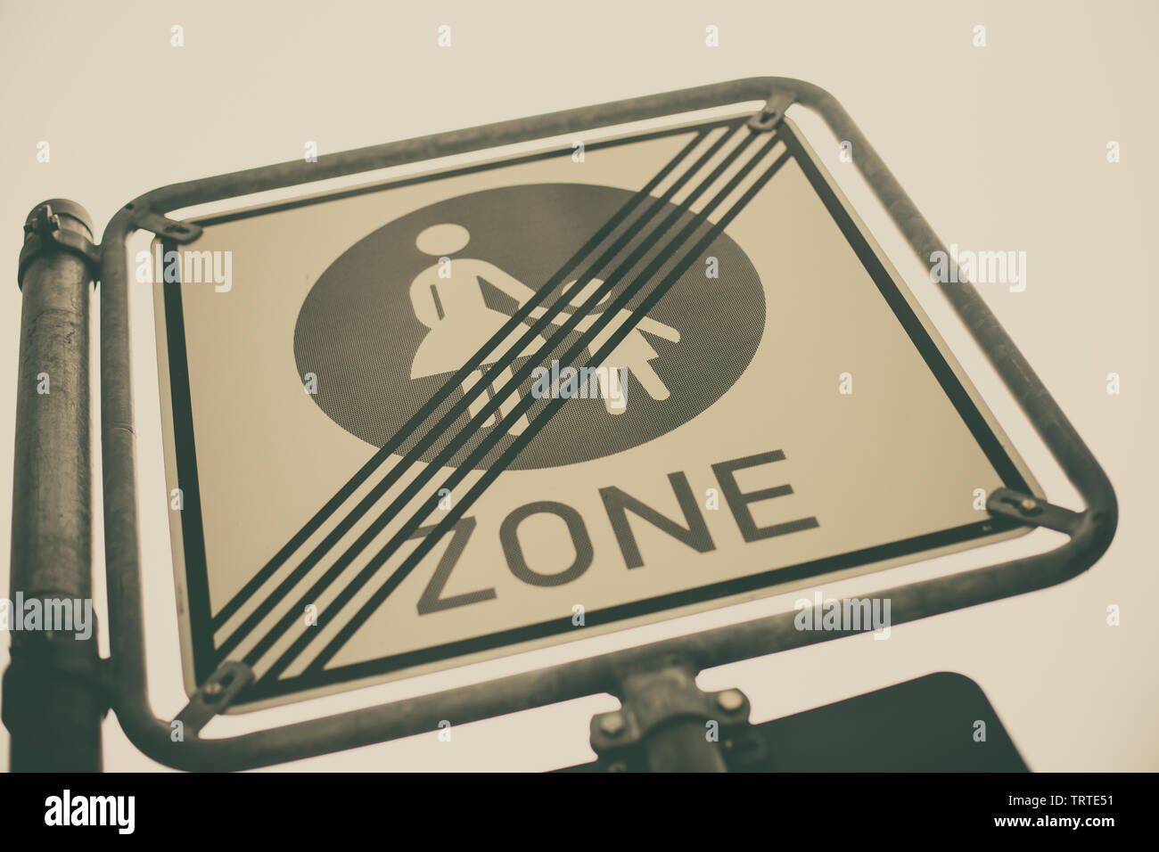 Close up shot of a pedestrian zone end sign on a pole Stock Photo - Alamy