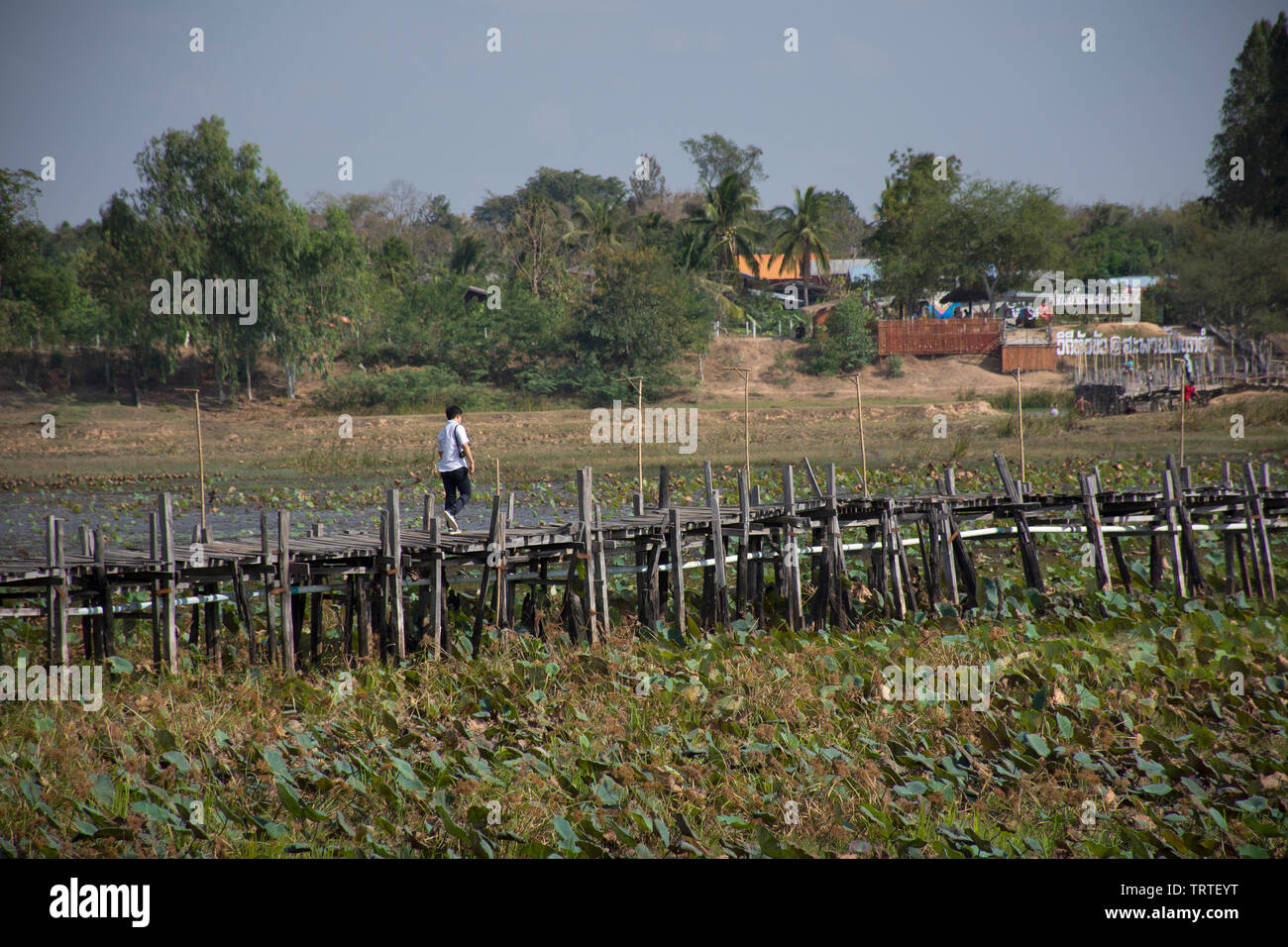Thai people and foreigner travelers travel and walking visit on Kae Dam ...