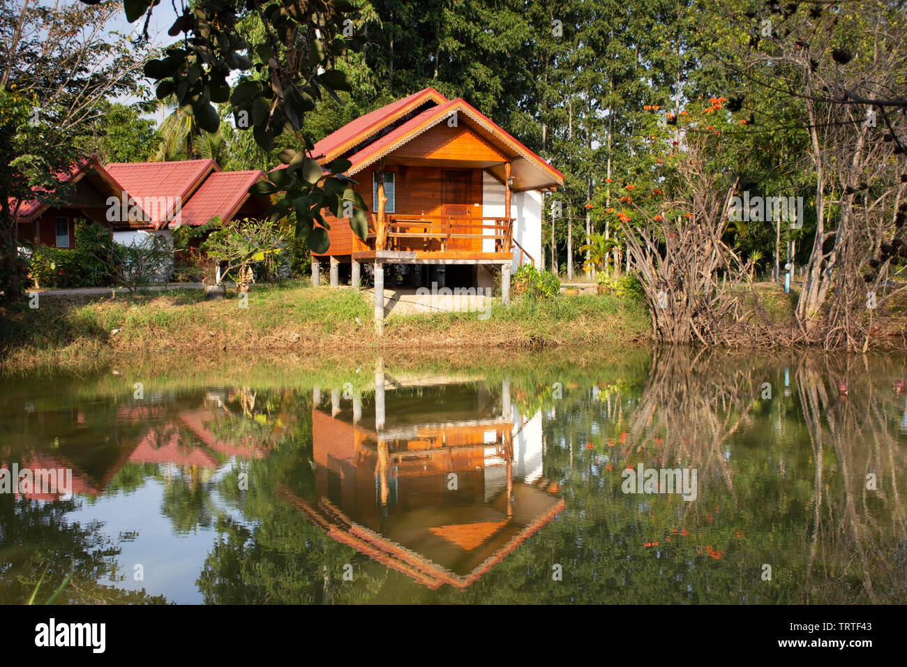Wooden hut in garden with pond of resort and homestay for thai people ...