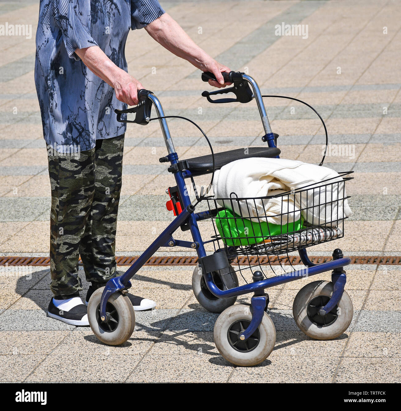 Old woman walks lonely hi-res stock photography and images - Alamy