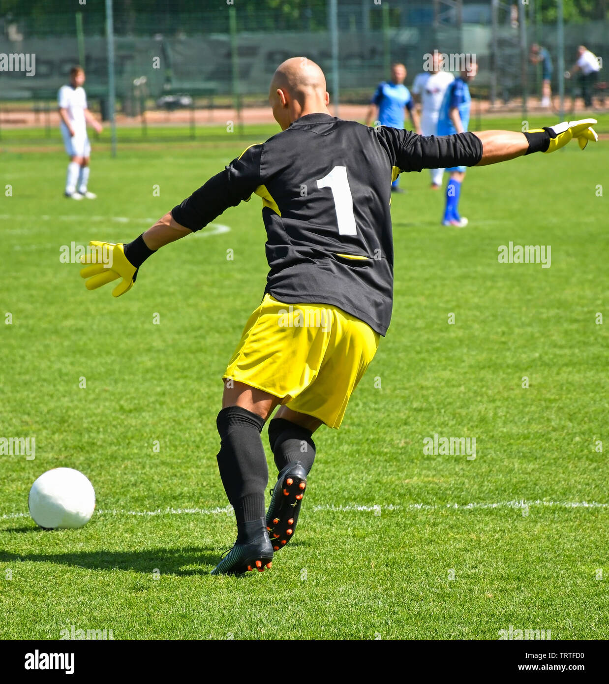 Goalkeeper kicks off the ball Stock Photo - Alamy