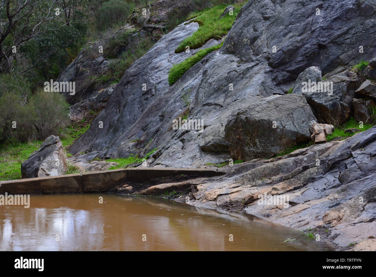 granite rock face with River Stock Photo - Alamy