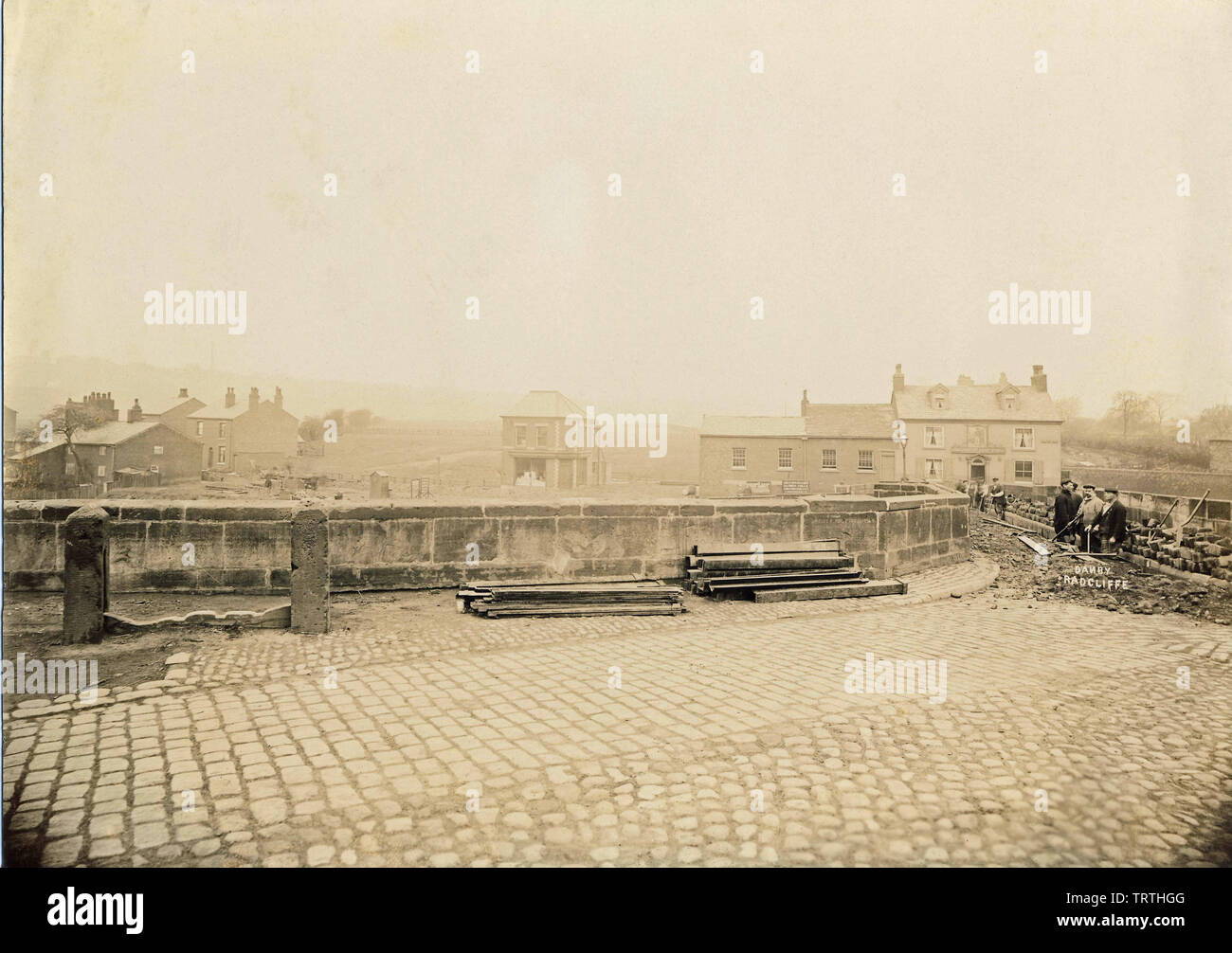 Historic archive image of men setting cobbles on Ringley Old Bridge at ...